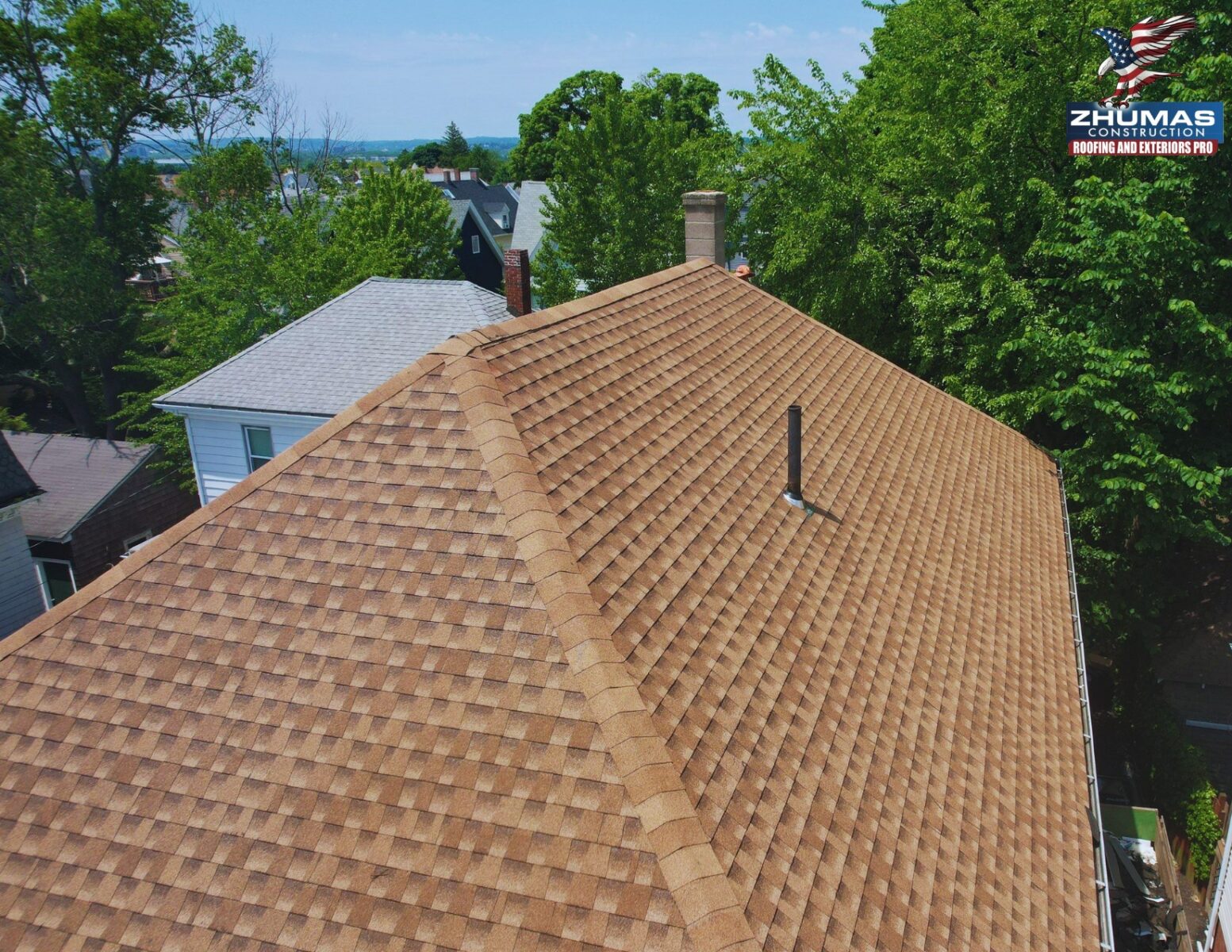 A Homeowner's Guide to a Safe and Secure Roof" - Zhumas Construction